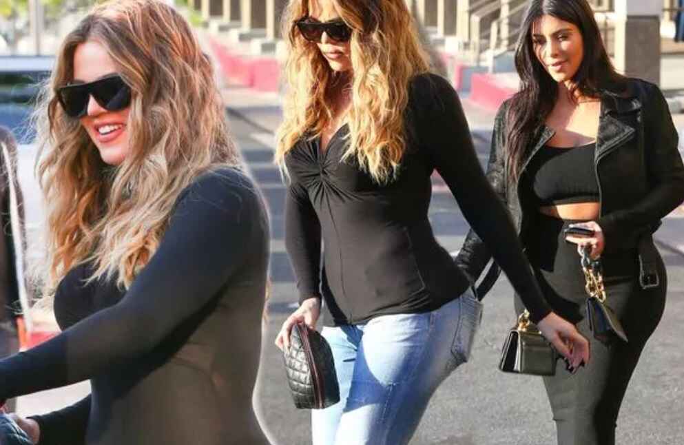 Kim Kardashian's Vacay Outfit: Black Stringy Top and Ripped Jeans
